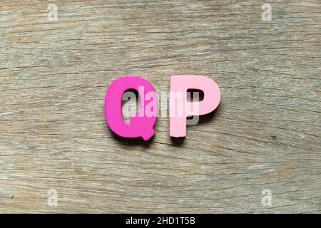 Alphabet letter in word QP (Abbreviation of Quality procedure) on wood ...