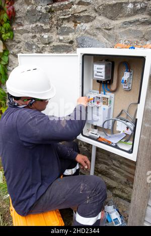Electrical engineer worker man connecting new residential electricity ...