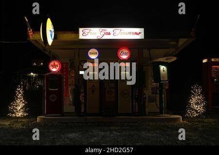 An old recreated gas station. Sign about "Free gas tomorrow Stock Photo ...