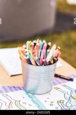 A closeup shot of a wooden cup holder with star anise and cloves in ...