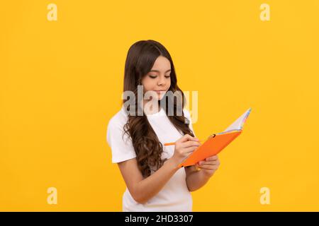 bookish kid making notes. student ready for studying. taking notes ...