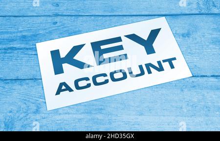 blank card with text KEY ACCOUNT on wooden background. Business concept ...