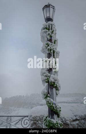 photo of a lamp wrapped in garland Stock Photo - Alamy