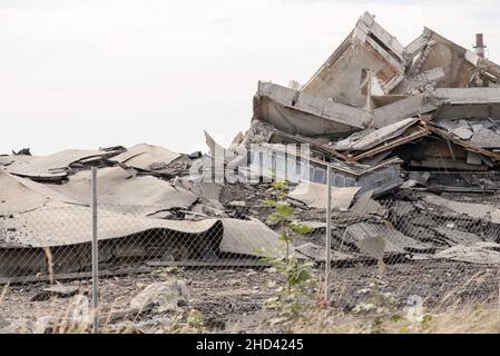 Industrial concrete building destructed by strike. Disaster scene full ...