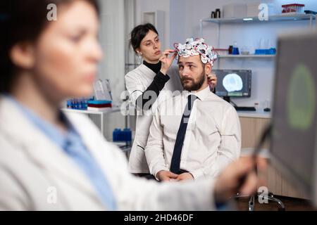 Specialist neurologist doctor monitoring brain evolution of patient ...