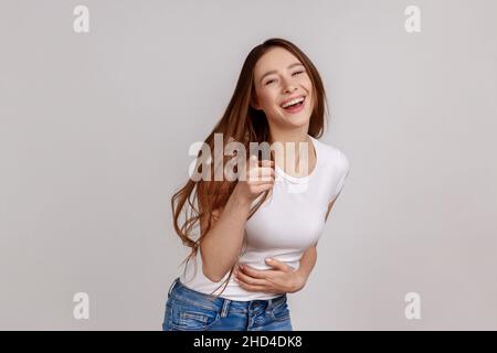 Hey you! Woman showing stop sign young man. Studio shot, isolated on ...