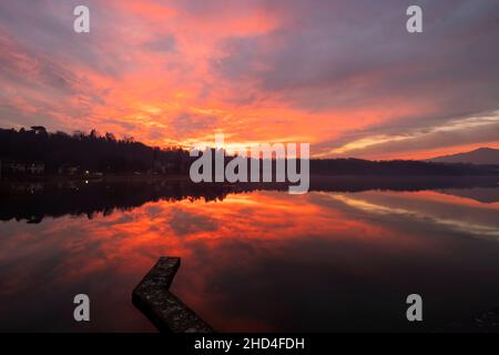 Dramatic sunset scenery of lake Como, set against the foothills of the ...