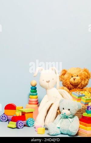 Toy box full of baby kid toys. Container with teddy bear, wooden ...