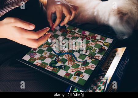 KORONADAL, PH – DEC 25, 2021: Popular snakes and Ladders board game AKA ...