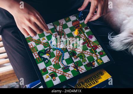 KORONADAL, PH – DEC 25, 2021: Popular snakes and Ladders board game AKA ...