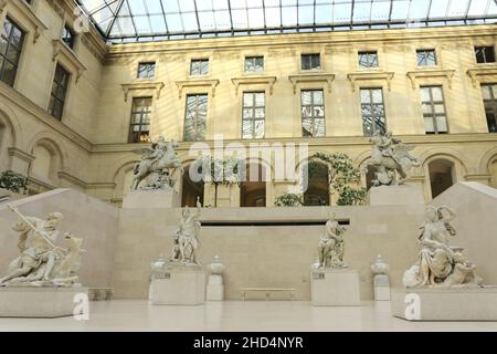 Sculptures in the glass-roofed courtyard known as Cour Marly in the ...
