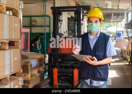 Worker checking raw material in store for factory industrial, Safety ...