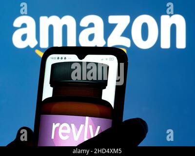 In this photo illustration a Revly logo seen displayed on a smartphone ...