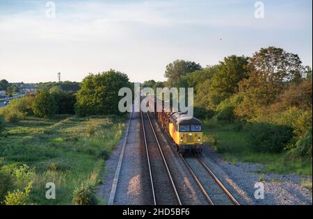 A Colas Railfreight class 56 locomotive hauling a train carrying timber ...