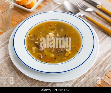 Mushroom nutritious soup with pork and other ingredients closeup Stock ...