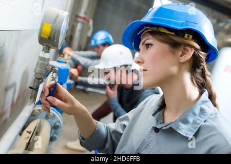 Woman working in the boiler room Stock Photo - Alamy
