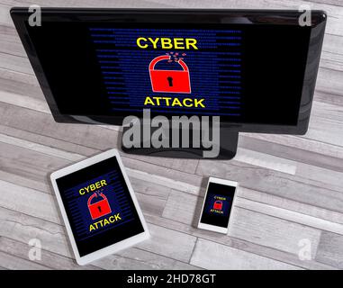 Cyber attack concept shown on different information technology devices ...