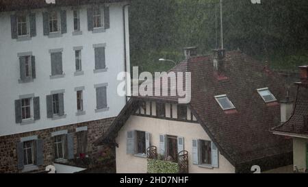 Falling rain in switzerland in slow-motion outside traditional city ...