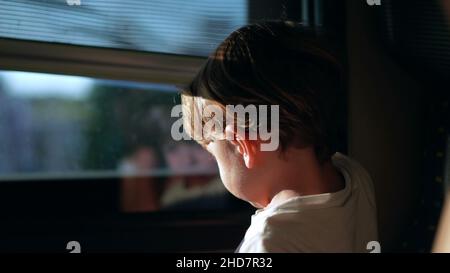 Small boy closing train window blind, child traveling by railroad Stock ...