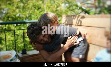 Two small brothers embrace. Authentic real life family love and ...