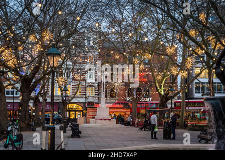 Sloane Square, a memorial city park decorated with Christmas lights ...