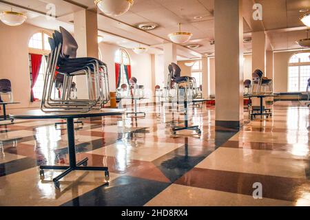 Closed High School cafeteria with chairs stacked on tables Stock Photo ...