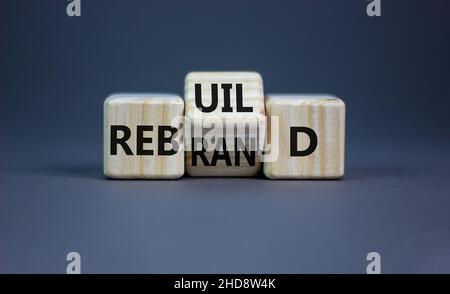 Rebrand and rebuild symbol. Businessman turnsa wooden cubes and changes ...