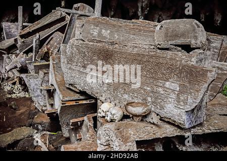 Weathered coffins (erong) in the 700 yr old burial cave at Lombock ...