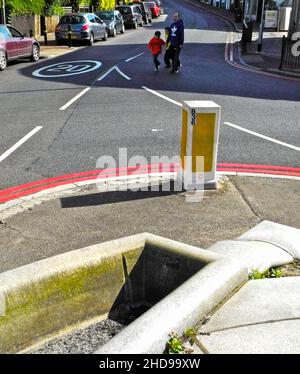 Double red line road markings on a UK road Stock Photo - Alamy
