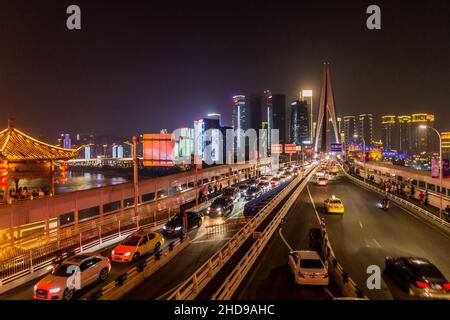 The night view of Qiansimen bridge and the skyline in Chongqing, China ...