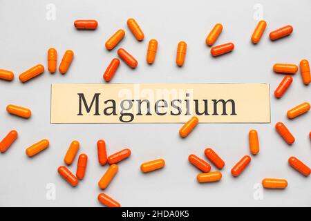 Colorful capsules and word MAGNESIUM on light background Stock Photo ...