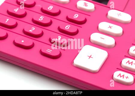 Pink calculator on white background Stock Photo - Alamy
