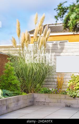 Superb courtyard with beautifully laid paths and trees Stock Photo - Alamy