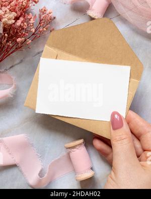 Blank card and envelope over pink background Stock Photo - Alamy