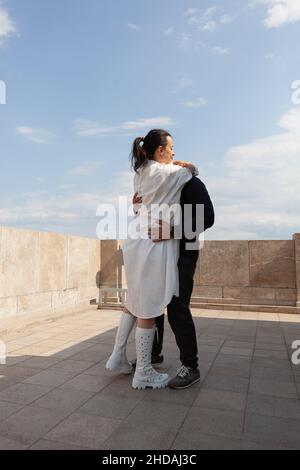 Married couple spending relationship anniversary on rooftop terrace ...
