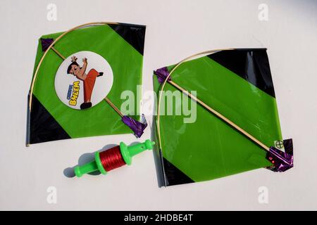 Colour kite with spool on white background Stock Photo - Alamy