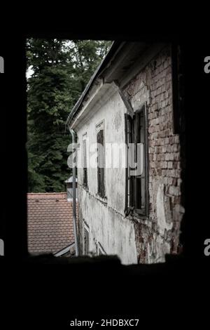 abandoned building seen from the window Stock Photo - Alamy
