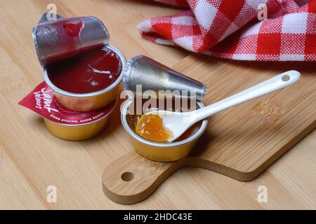 Jam in portion pack with spoon, jam Stock Photo - Alamy