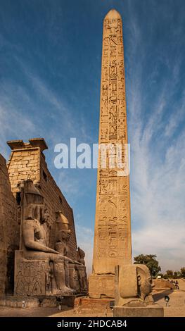 Entrance pylon flanked by two colossal statues of Ramses, Luxor Temple ...