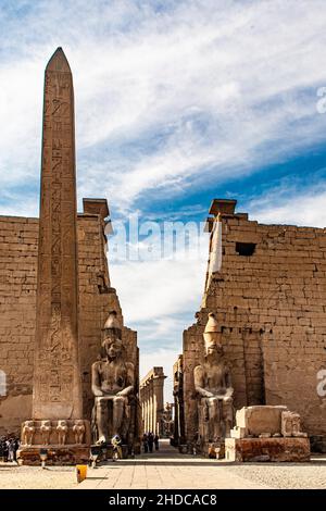 Entrance pylon flanked by two colossal statues of Ramses, Luxor Temple ...