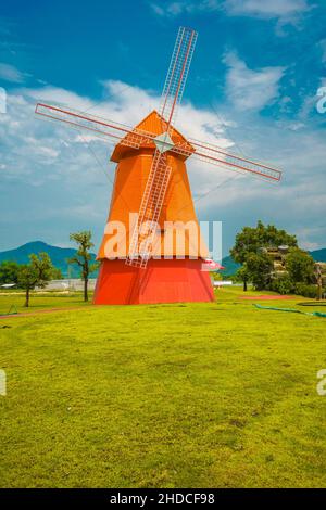 Vertical shot of an old windmill on a field at sunset Stock Photo - Alamy