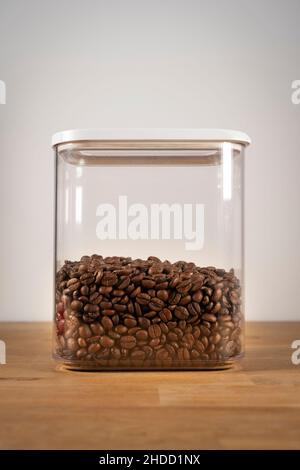 An airtight bag of coffee beans on a white surface Stock Photo - Alamy