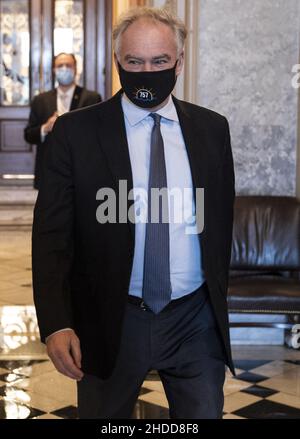 Sen. Tim Kaine, D-Va., walks from a policy luncheon on Capitol Hill ...