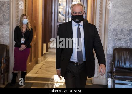Sen. Tim Kaine, D-Va., walks from a policy luncheon on Capitol Hill ...