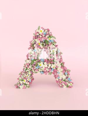 Romantic spring letters made of pink petals, on color wooden background ...