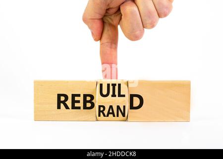 Rebrand and rebuild symbol. Businessman turnsa wooden cubes and changes ...