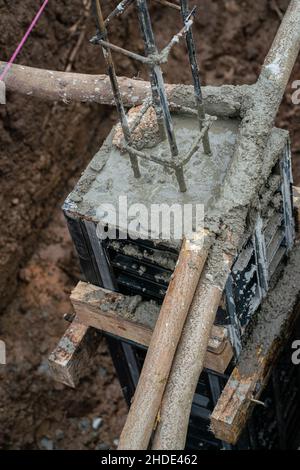 Cement concrete poll in construction site wall building new house ...