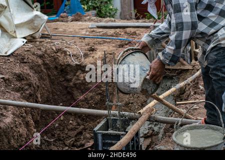 Cement concrete poll in construction site wall building new house ...