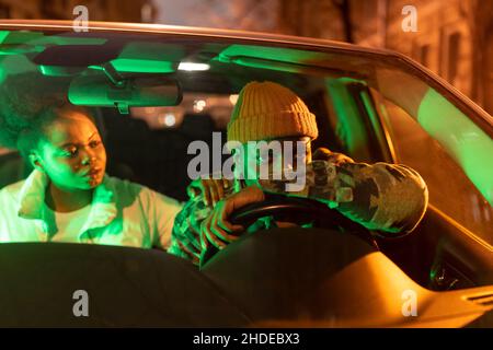 A young man in the car discussing business matters by phone Stock Photo ...