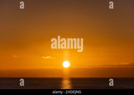 The rising sunrise at Rustington in West Sussex Stock Photo - Alamy